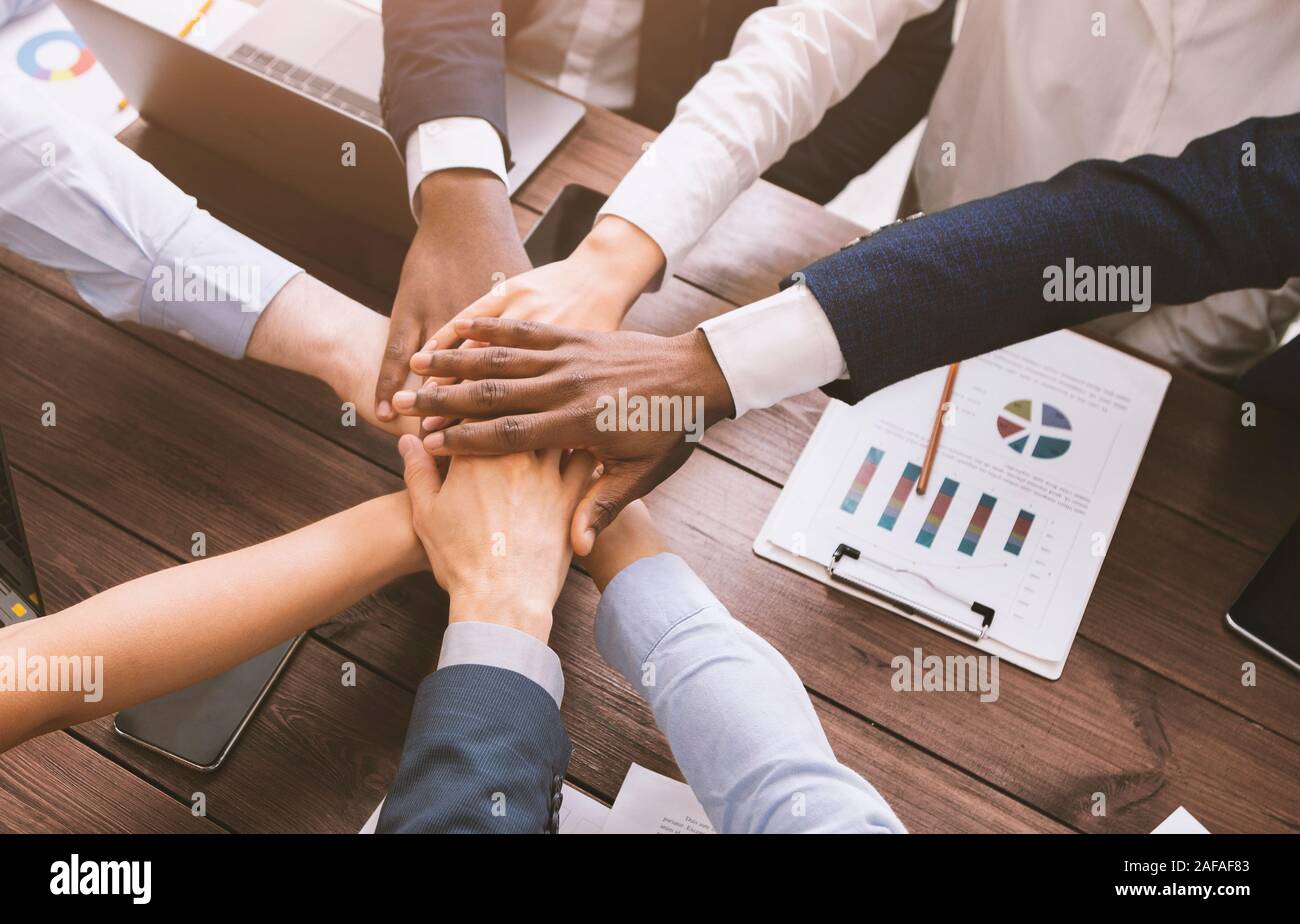 Top view on diverse corporate team hands stacked together Stock Photo ...