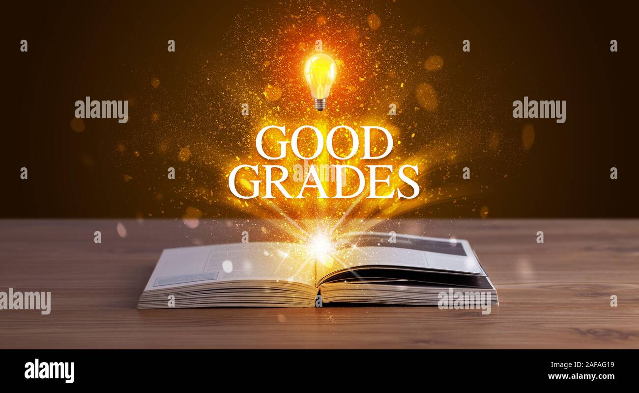 GOOD GRADES inscription coming out from an open book, educational ...