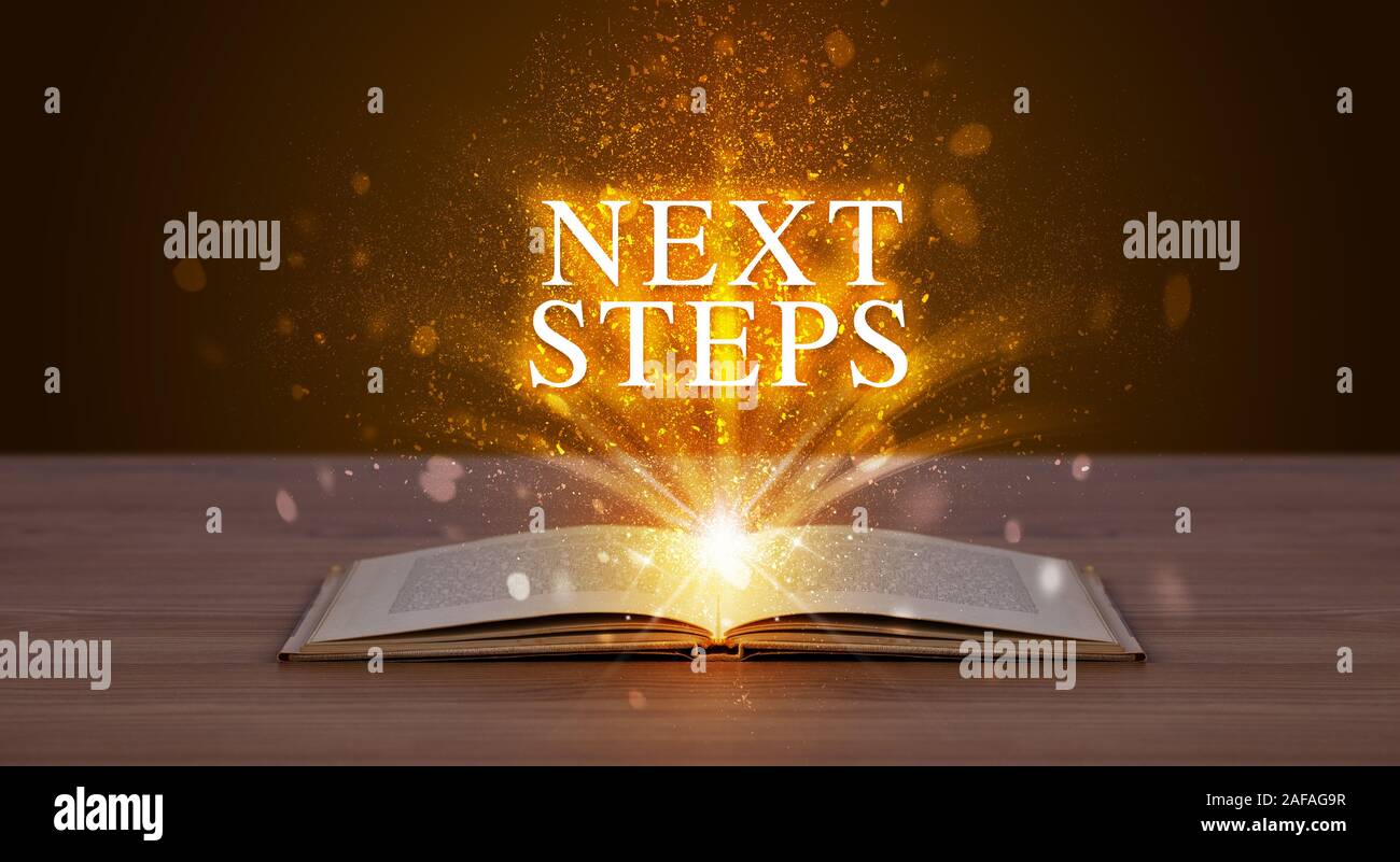 NEXT STEPS inscription coming out from an open book, educational ...