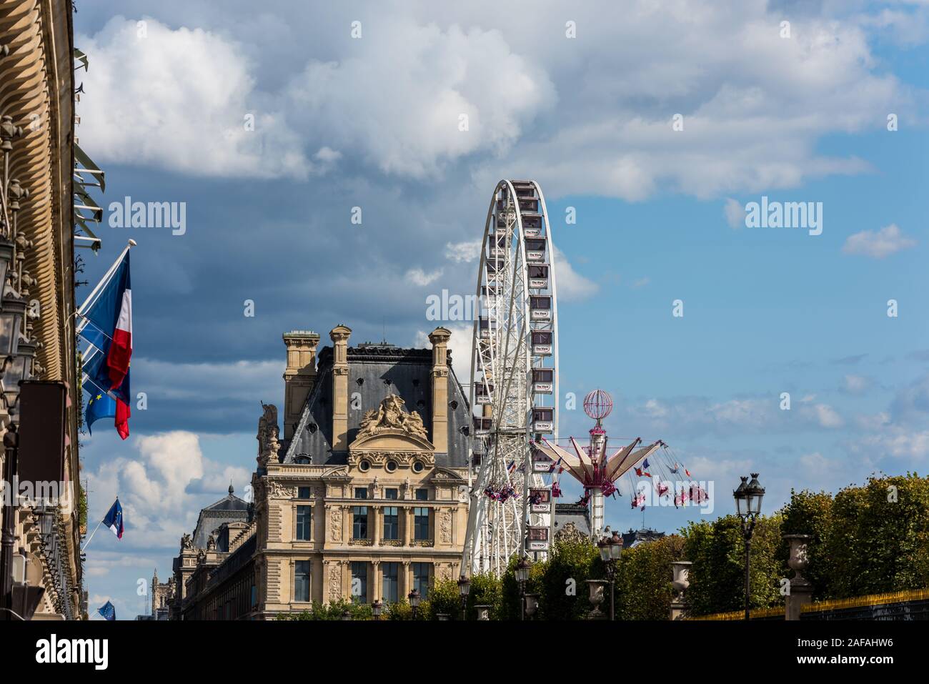 The Paris Ferris Wheel on the Place de la Concorde Louvre Museum at the ...