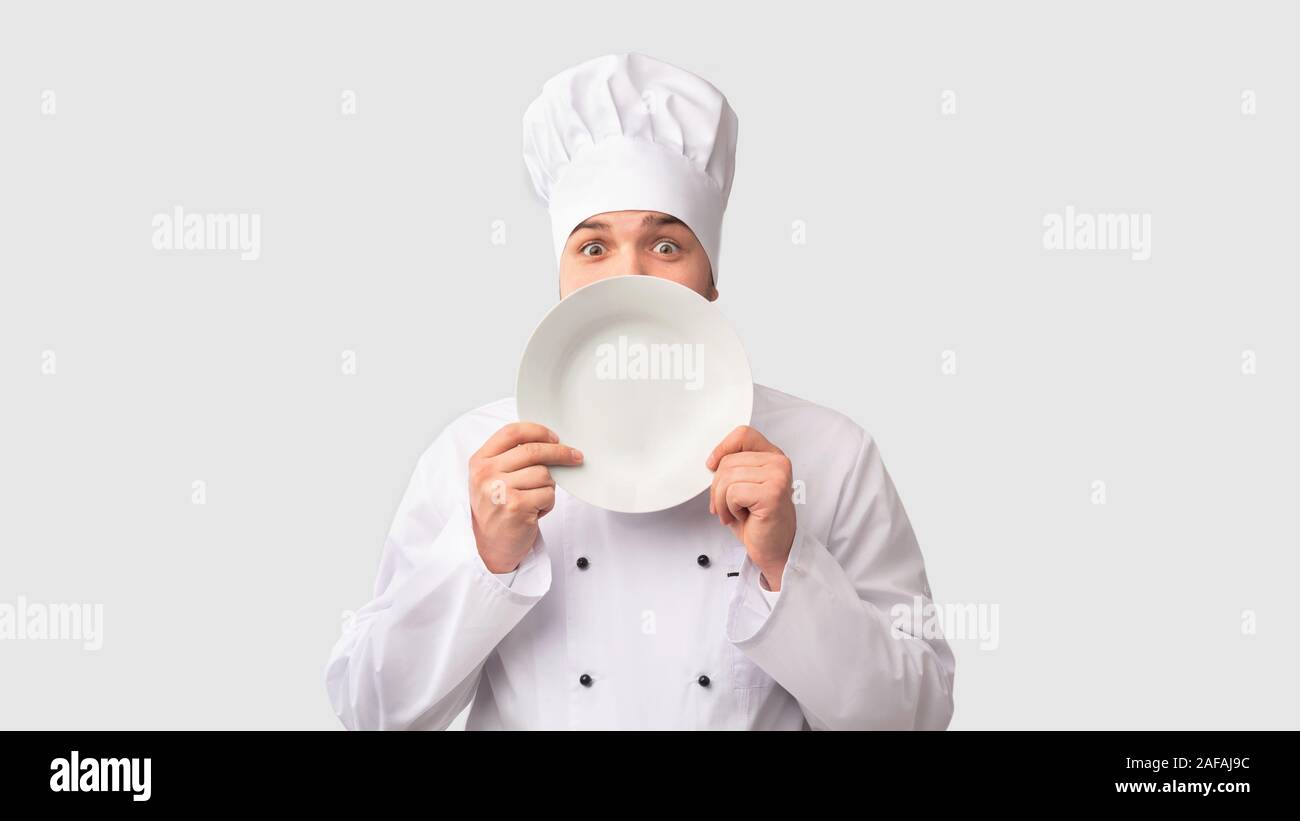 Cook Man Holding Plate Near Face Standing, White Background Stock Photo ...