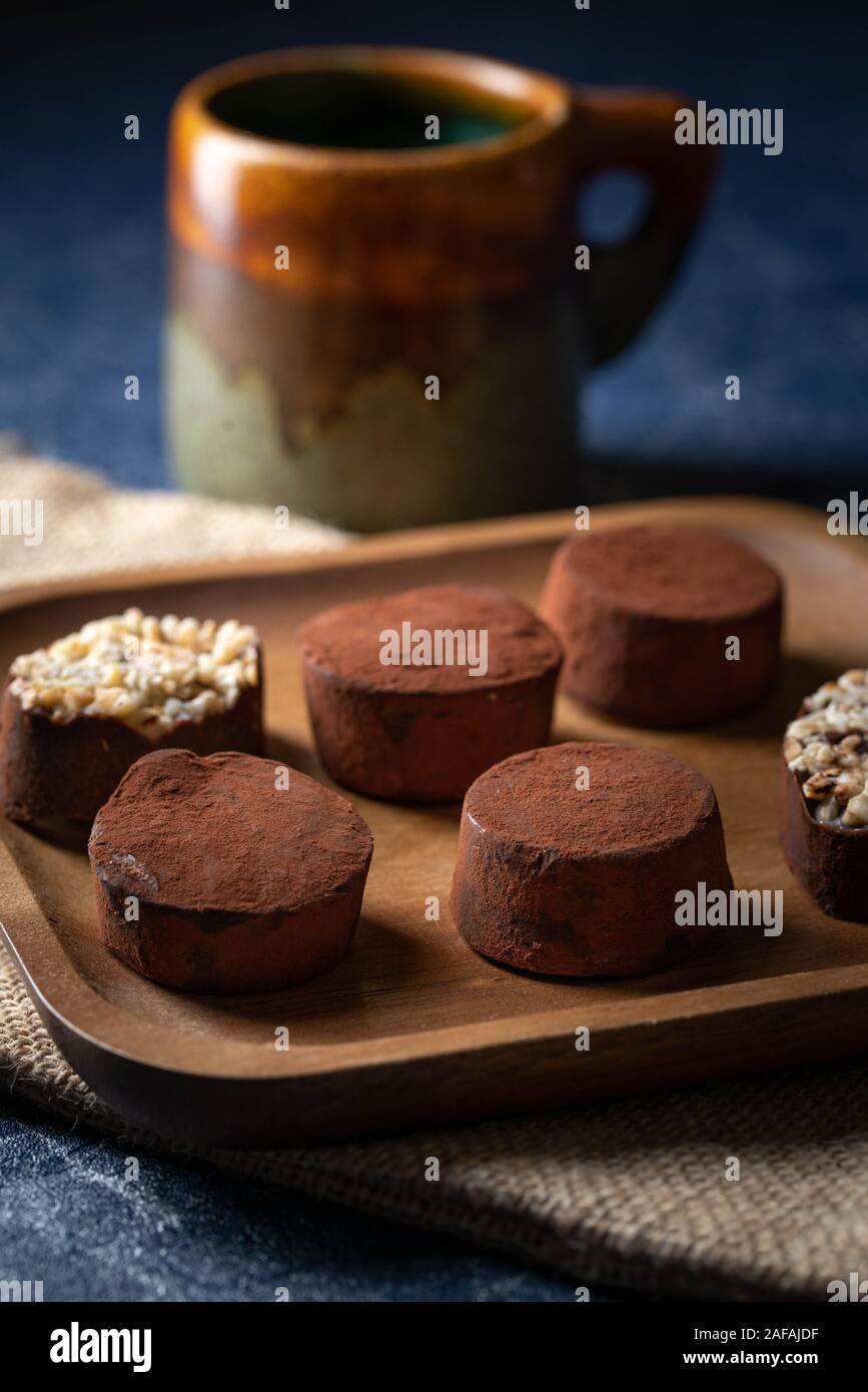 chocolate truffles on a wooden plate Stock Photo - Alamy