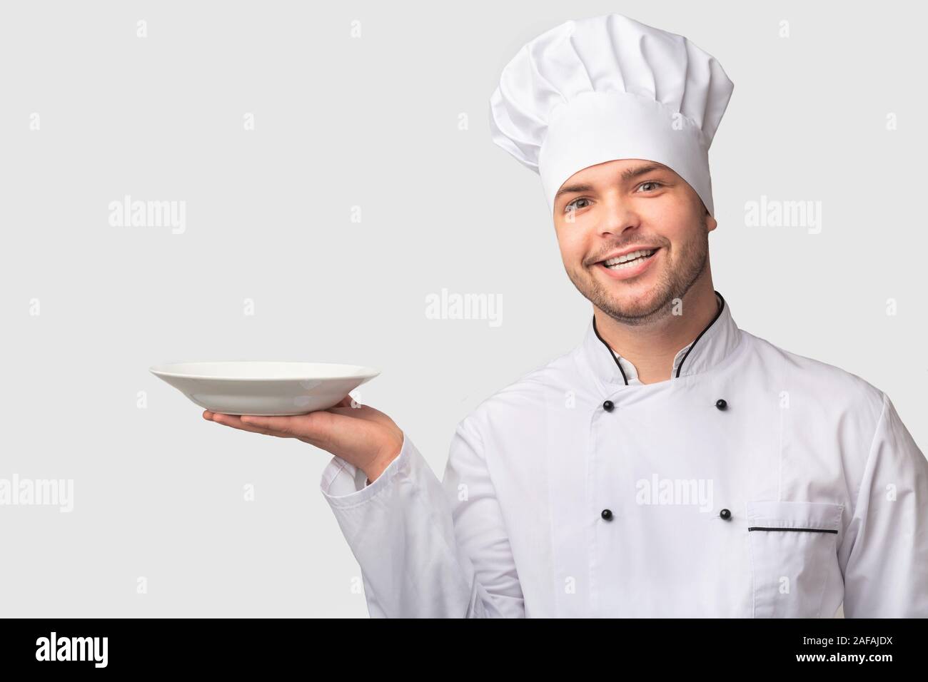 Chef Man Holding Empty Plate Smiling Standing Over White Background ...