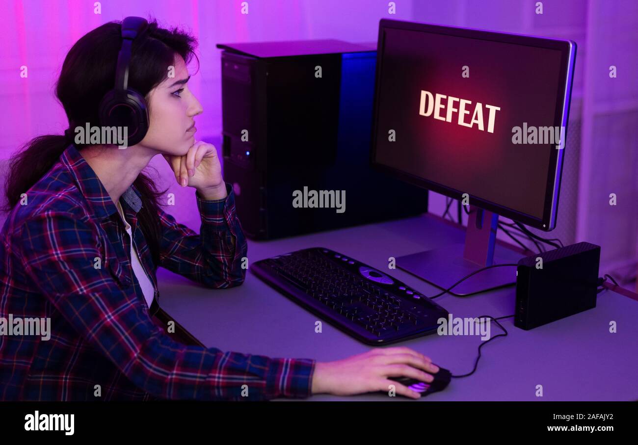 Sad gamer lost game, playing online on computer Stock Photo - Alamy