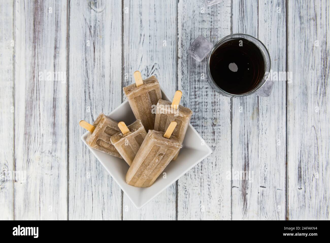 Some homemade Cola Popsicles (close-up shot; selective focus) on ...