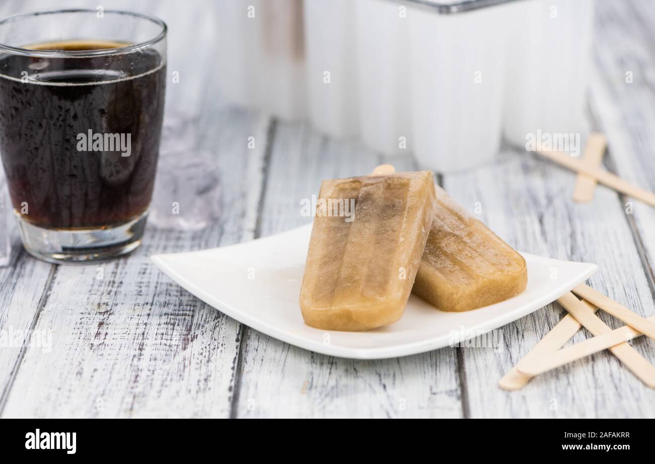 Cola Popsicles (selective focus) on a vintage background as detailed ...