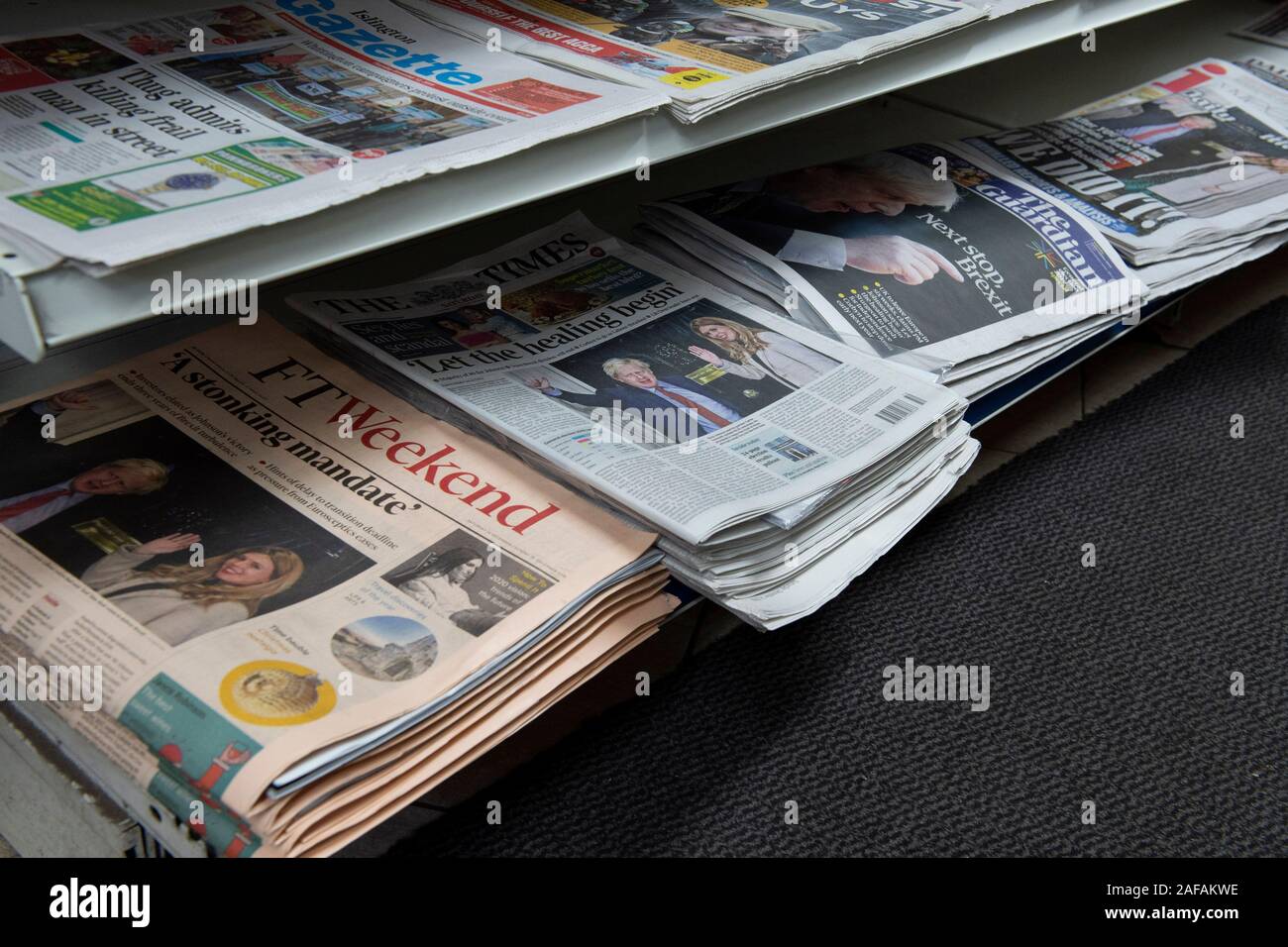 Newspapers on display at a newsagents in London the day after the ...