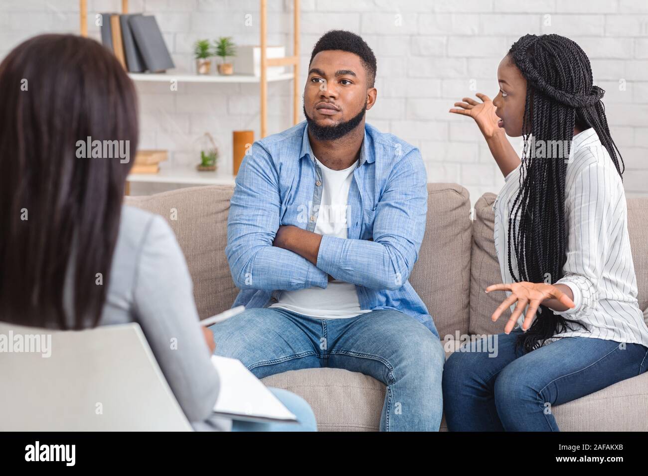 Disappointed wife blaming her indifferent husband during marriage ...