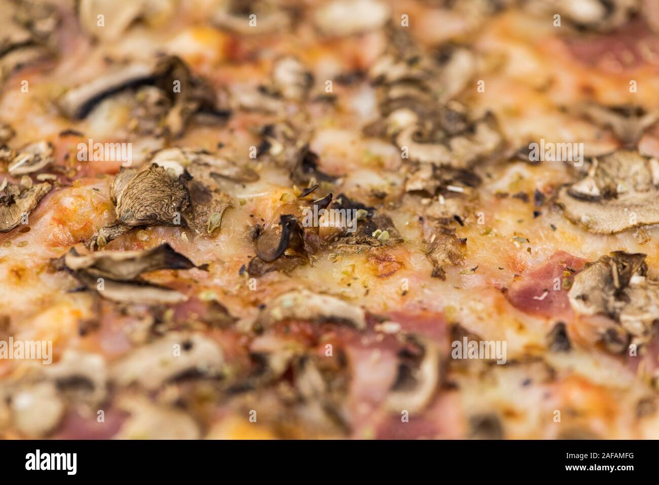 Fresh made Pizza full screen macro shot for use as background image or ...