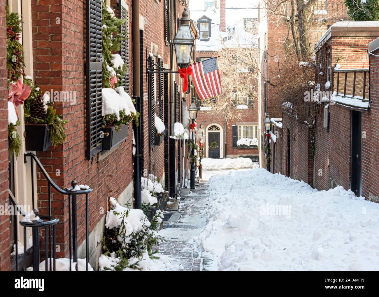 USA, Boston - January 2018 - Acorn Street in the snow with the American ...