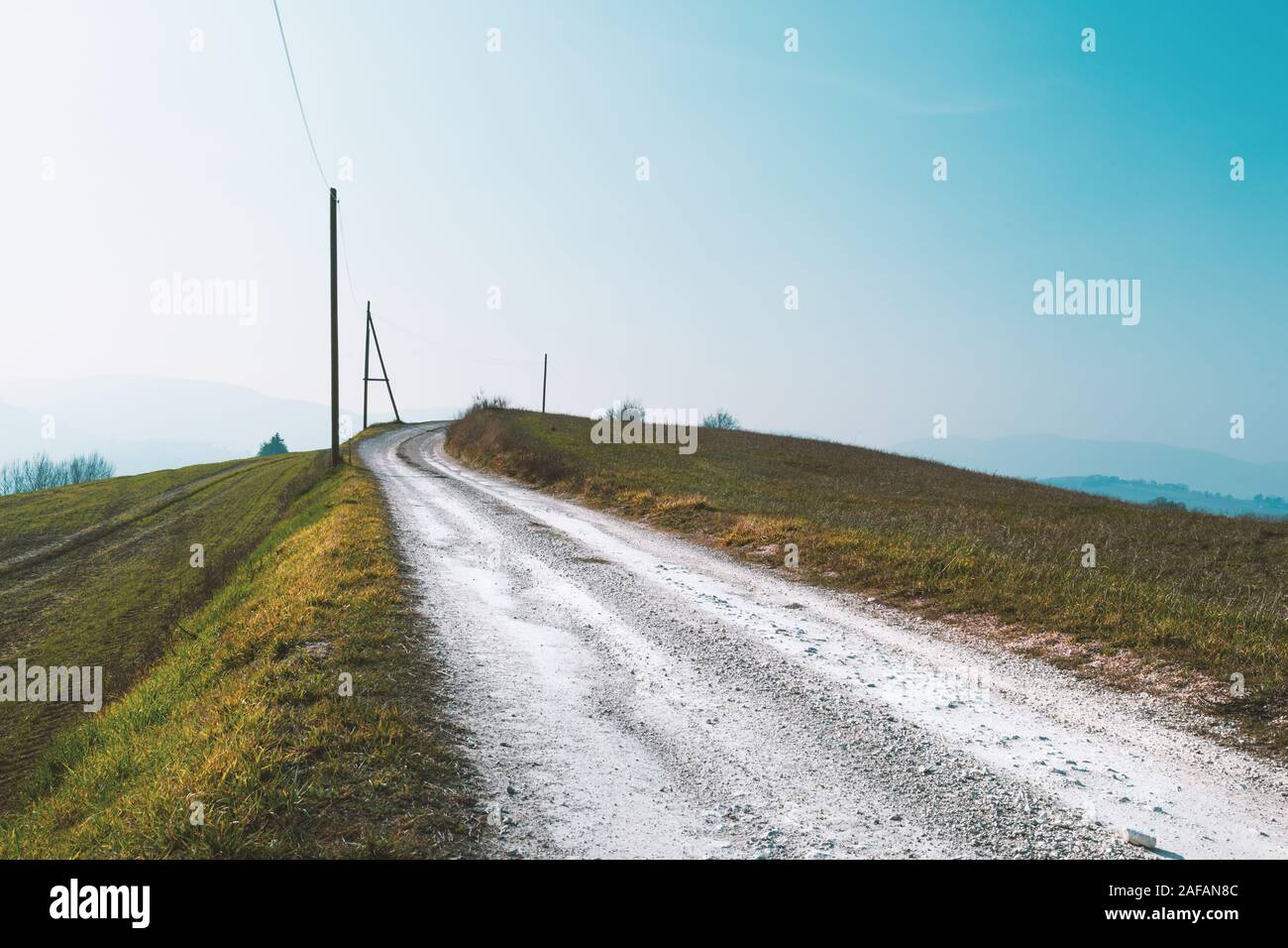 Rural landscape, fields and white country road, clear blue sky Stock ...
