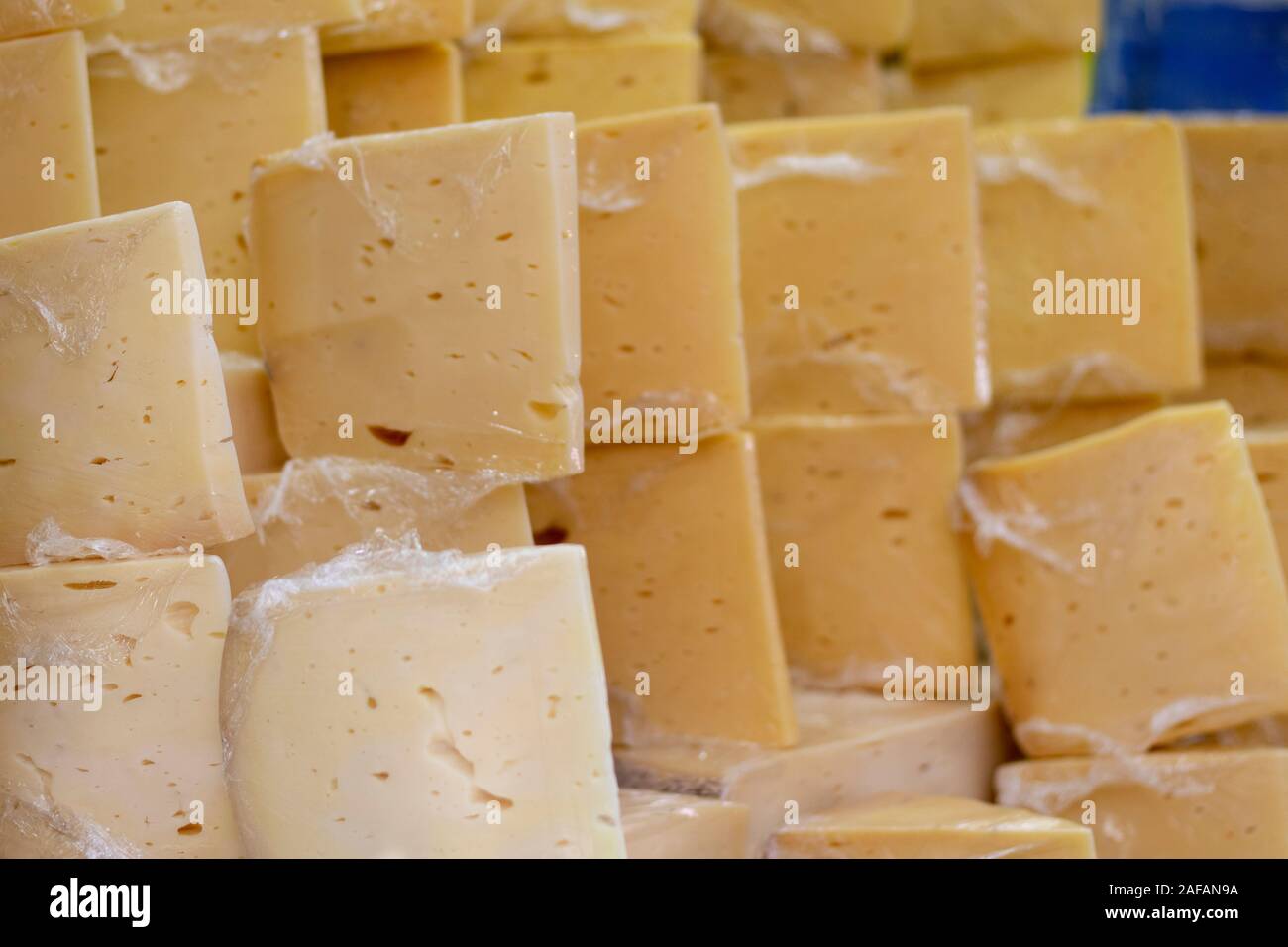 Traditional Old Sliced Turkish Kars cheddar cheese and cheese blocks ...