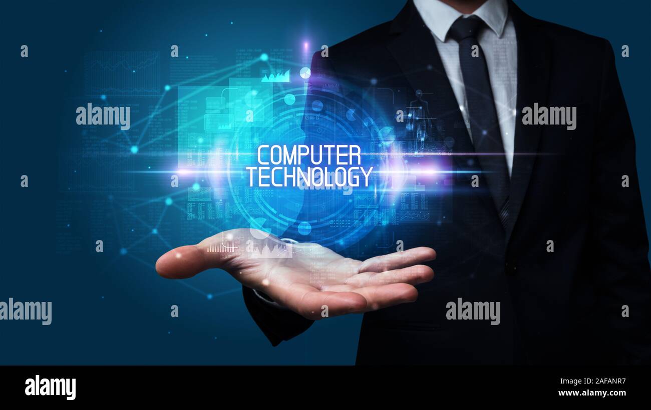 Man hand holding COMPUTER TECHNOLOGY inscription, technology concept ...