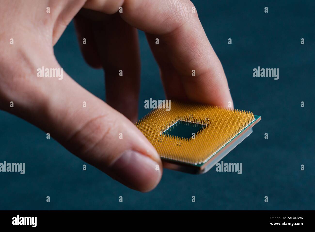 Hand holding CPU. Coonsumer 7 nanometer desktop CPU, processoor ...