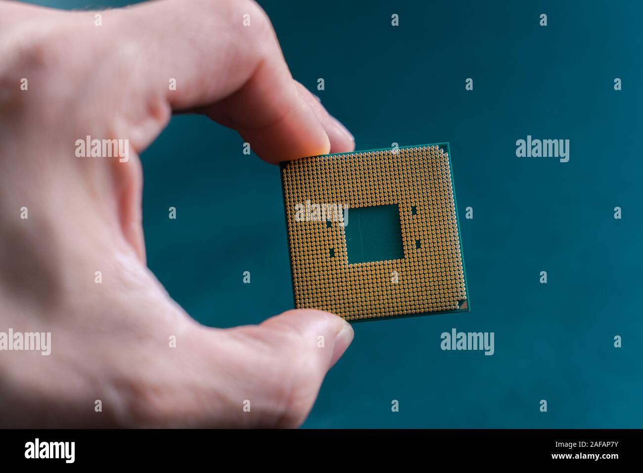Hand holding CPU. Coonsumer 7 nanometer desktop CPU, processoor ...