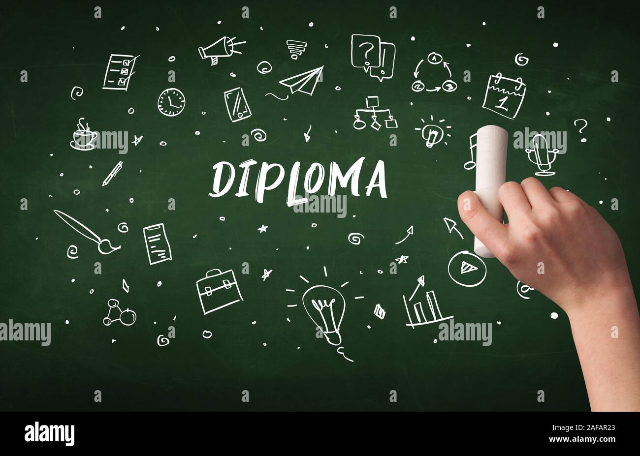 Hand drawing DIPLOMA inscription with white chalk on blackboard ...