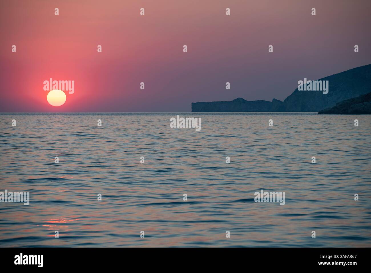 The sun sets on the Turkish coast Stock Photo - Alamy