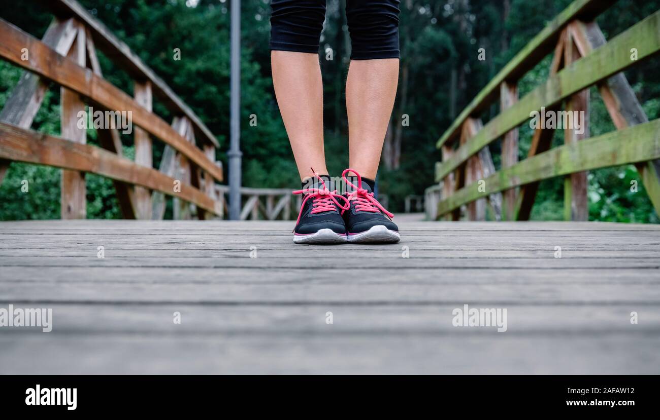 Athlete woman feet ready to train Stock Photo - Alamy