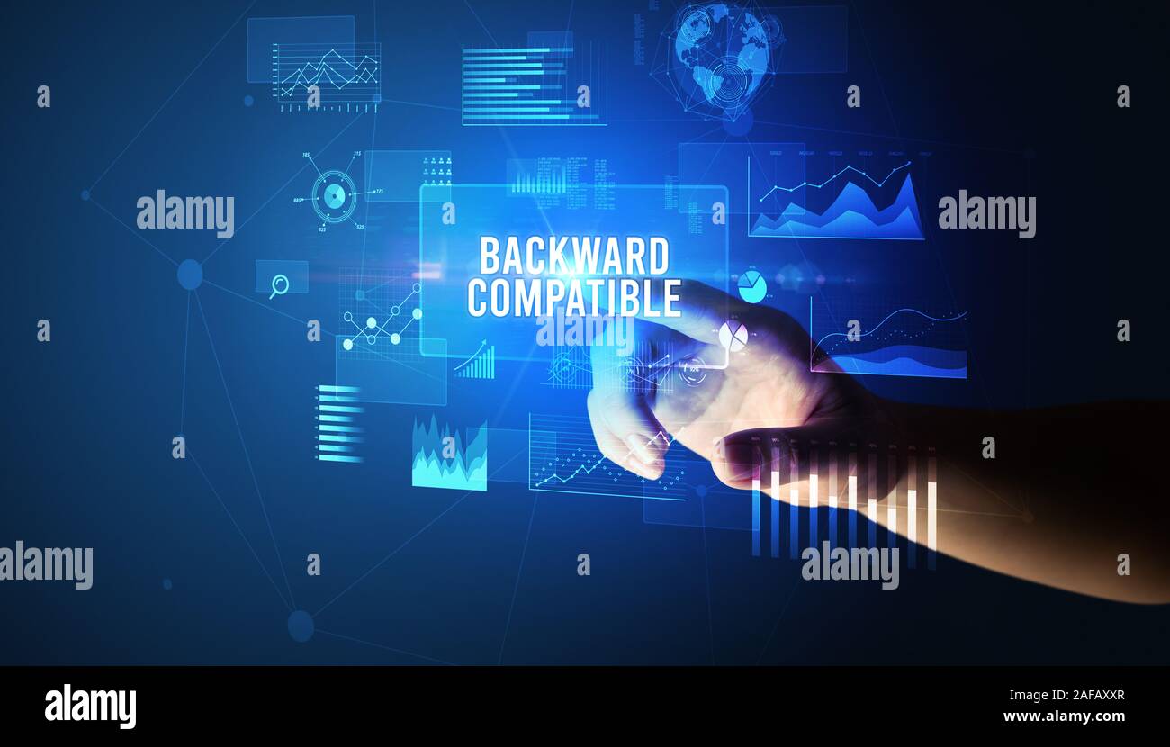 Hand touching BACKWARD COMPATIBLE inscription, new business technology ...