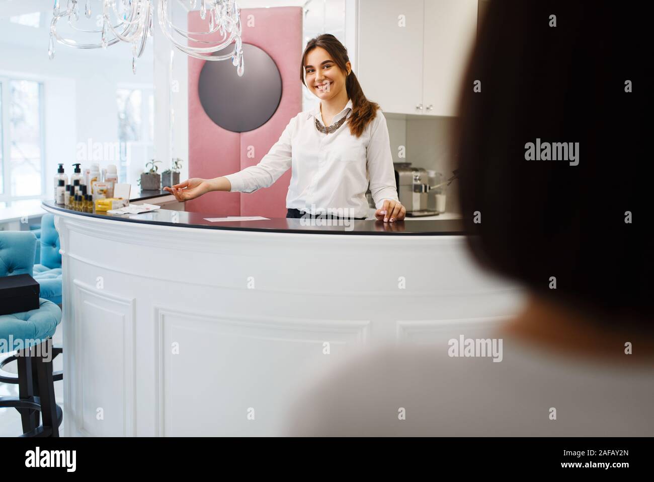 Administrator of beauty salon behind the reception Stock Photo - Alamy