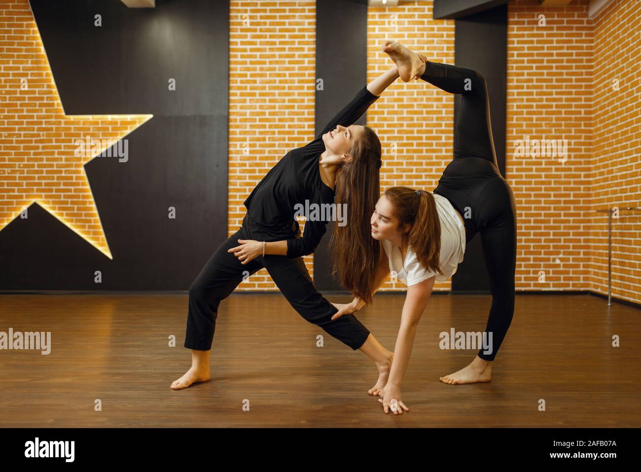 Two contemporary dance performers poses in studio Stock Photo - Alamy