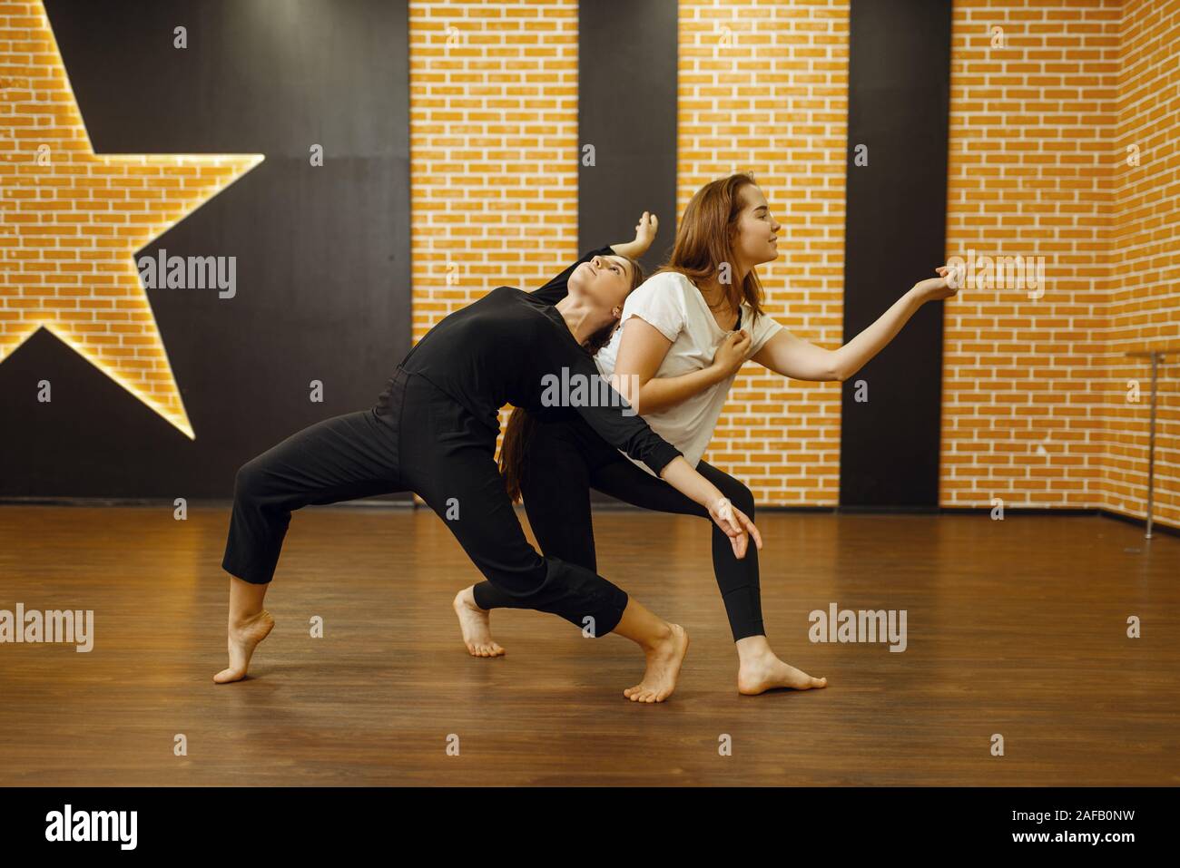 Two contemporary dance performers poses in studio Stock Photo - Alamy