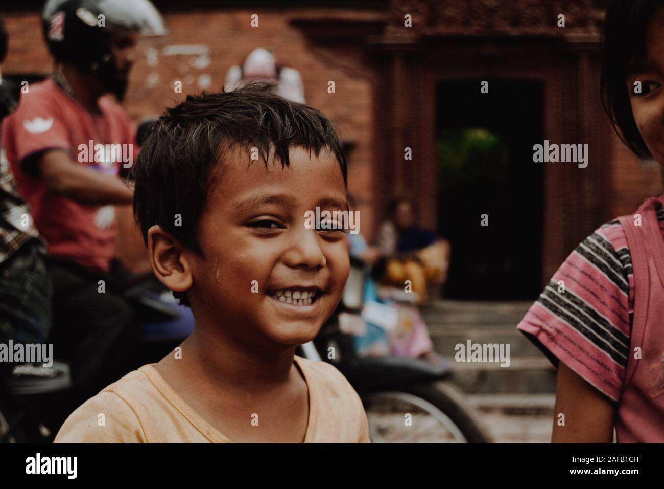 Happy kid looking at the camara in Kathmandu Stock Photo - Alamy