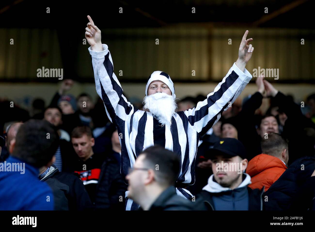 A Newcastle United fan in Christmas fancy dress in the stands before ...