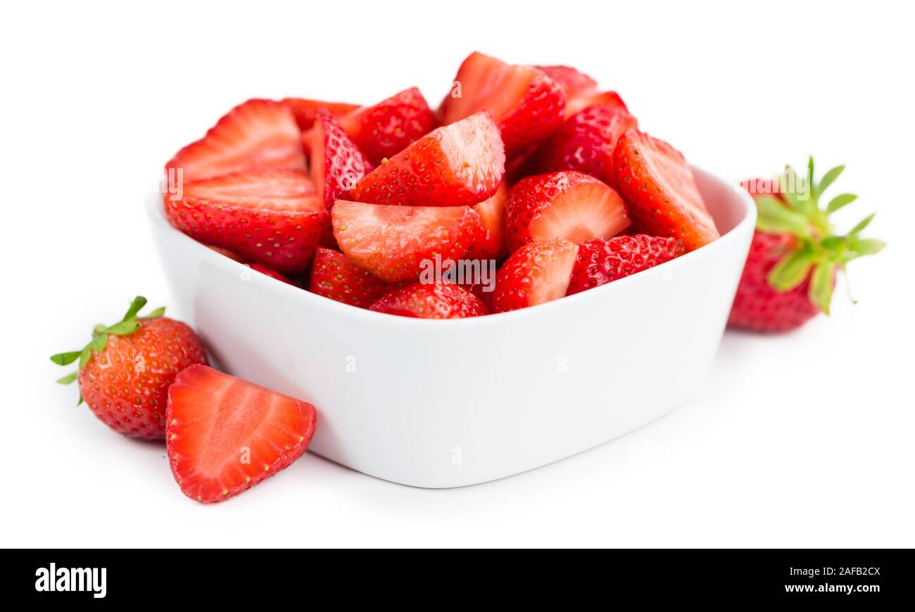 Fresh made Chopped Strawberries isolated on white background; close-up ...