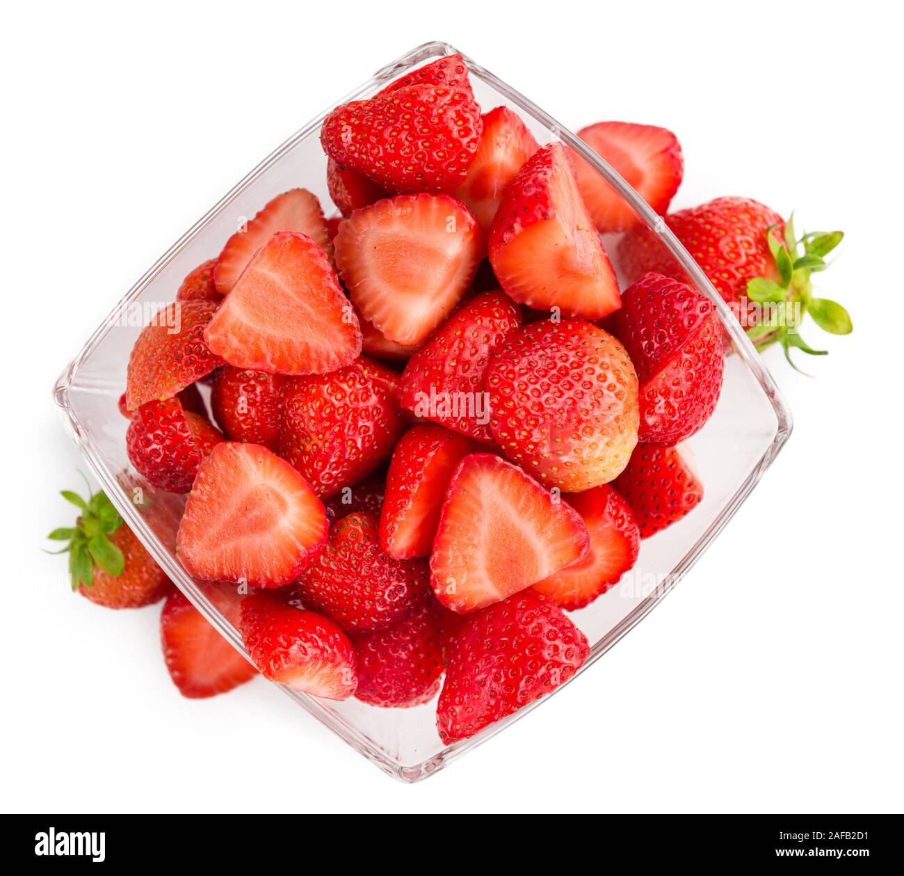 Fresh made Chopped Strawberries isolated on white background; close-up ...