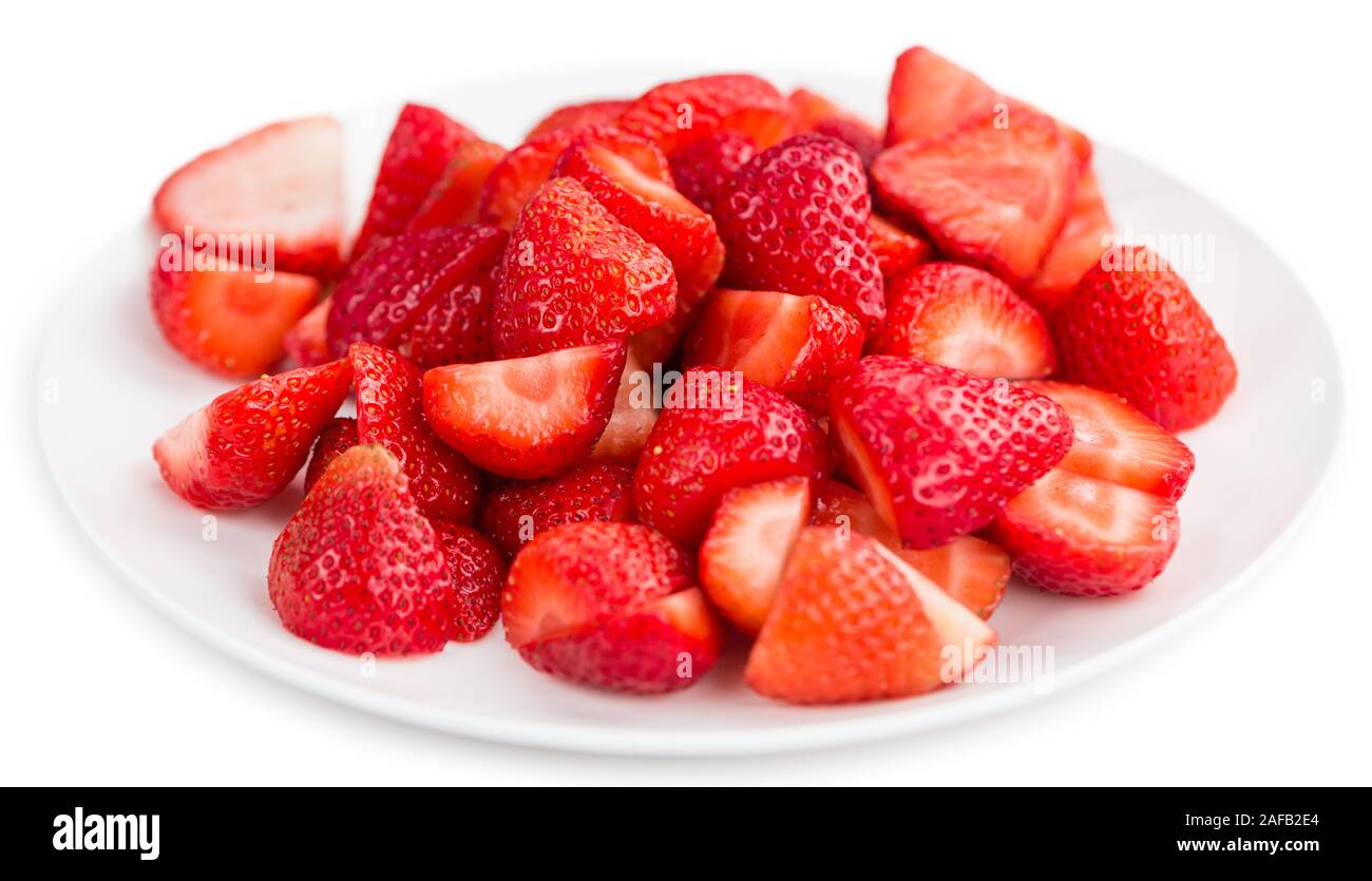 Fresh made Chopped Strawberries isolated on white background; close-up ...