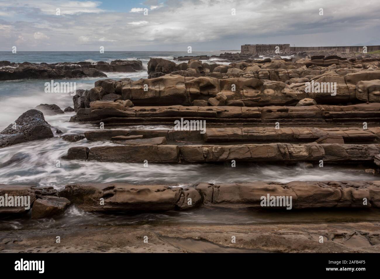 View of Xiaoyeliu, a seaside scenic area known for its unique sandstone ...