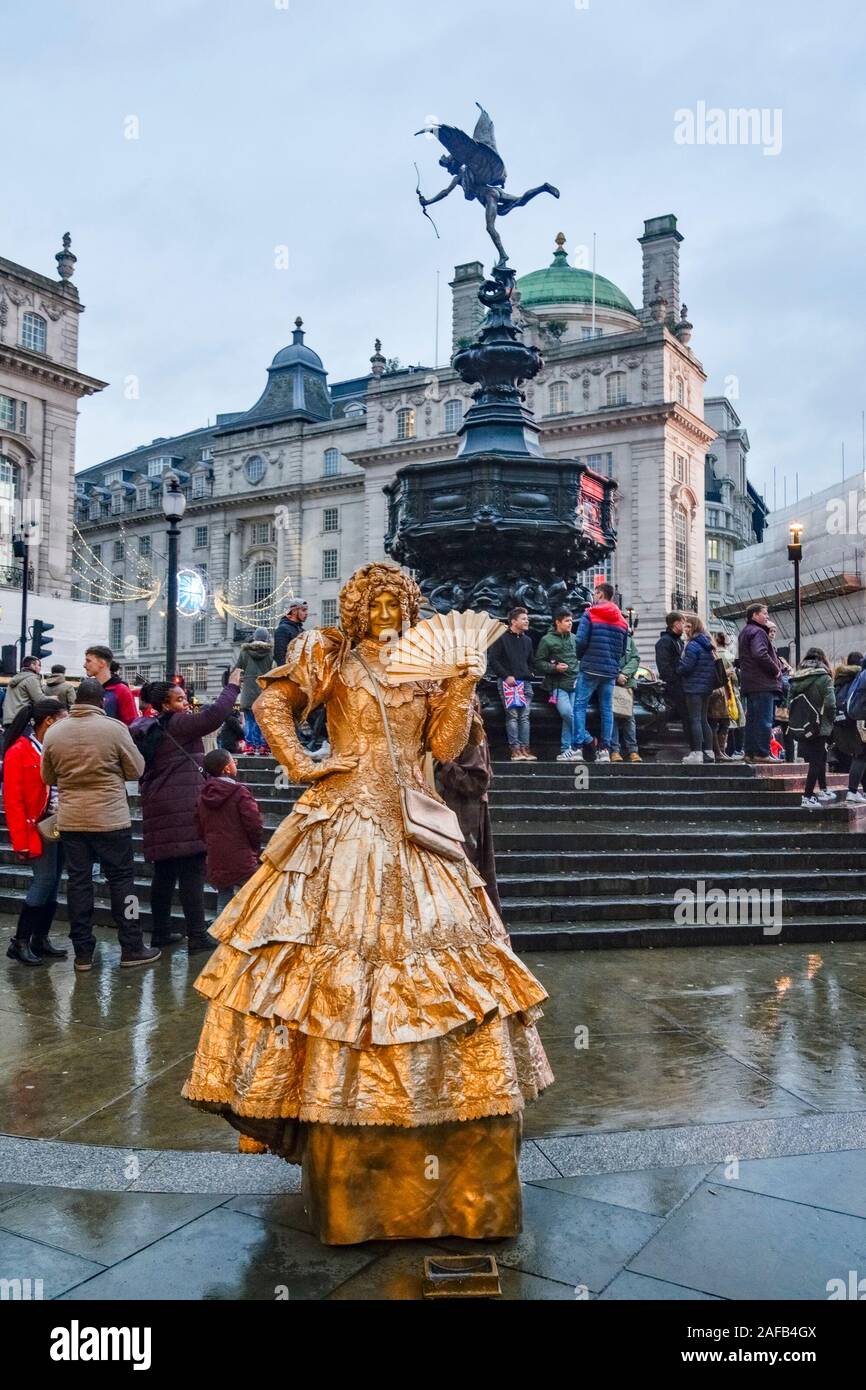 Gold clad, golden street peformer, mime, Piccadilly Circus, London ...