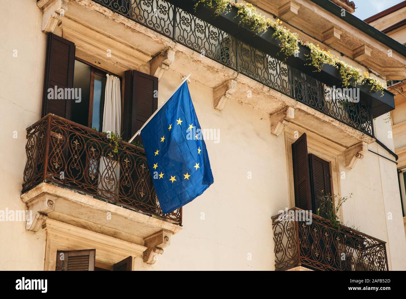 European Union flag on the facade or balcony of a residential building ...
