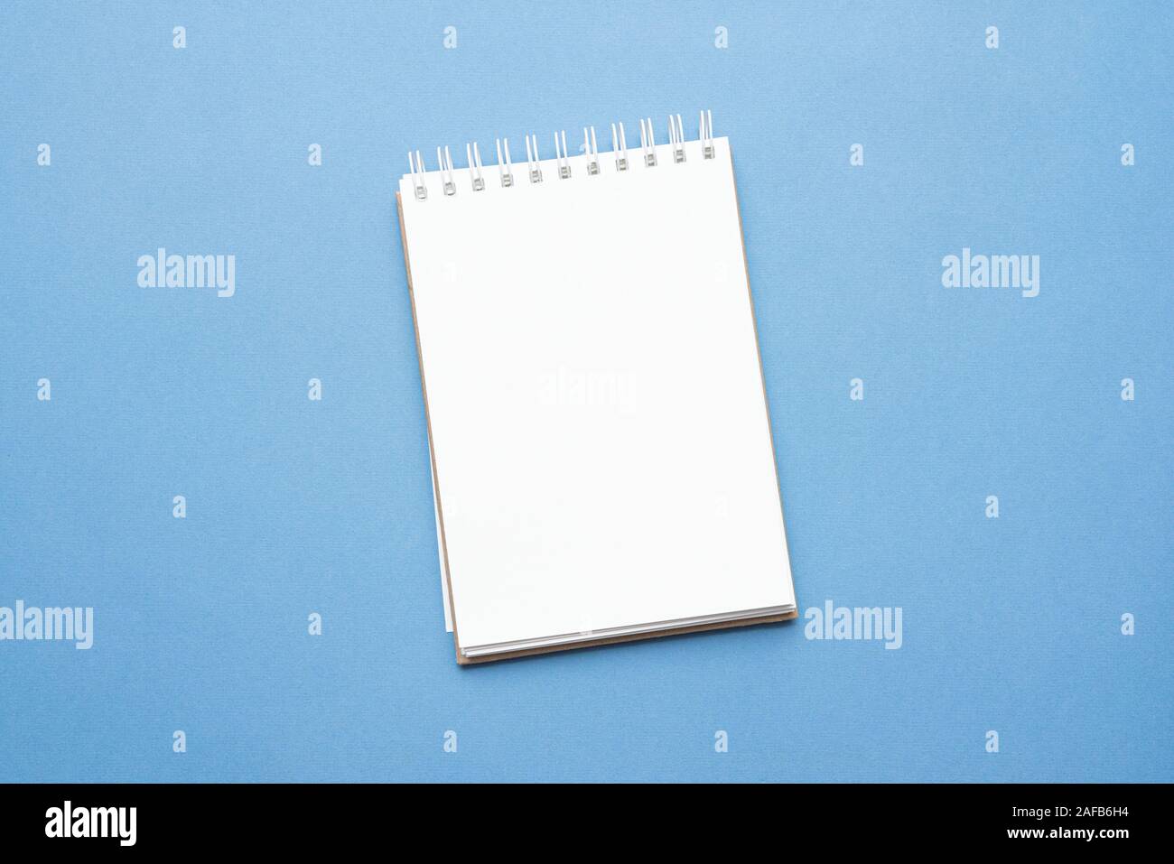 Blank page notepad with copy space on blue top view background Stock ...