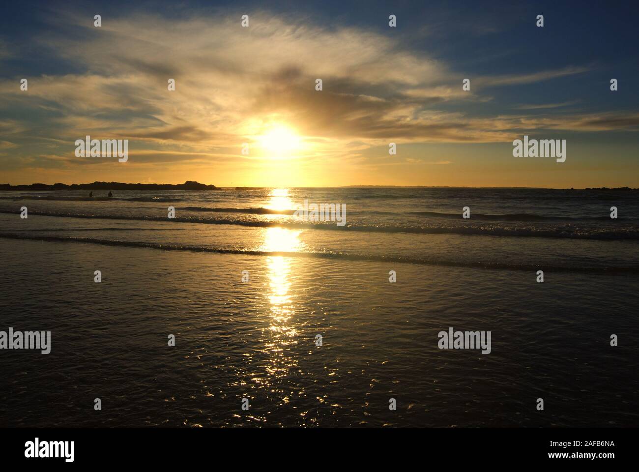 Seascape with low sun behind clouds hi-res stock photography and images ...