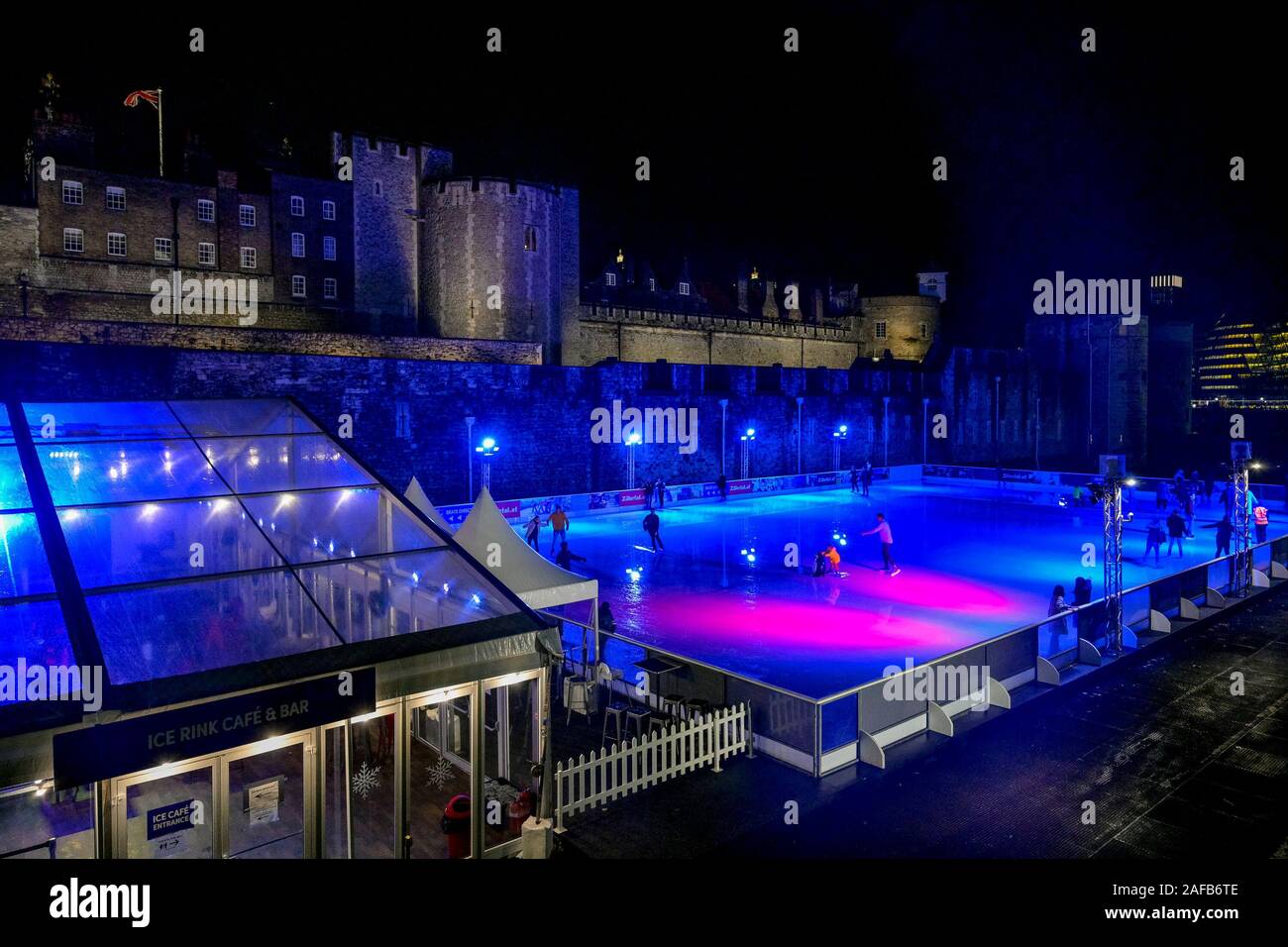 Ice skating rink, Tower of London, castle at night, London, England, UK ...
