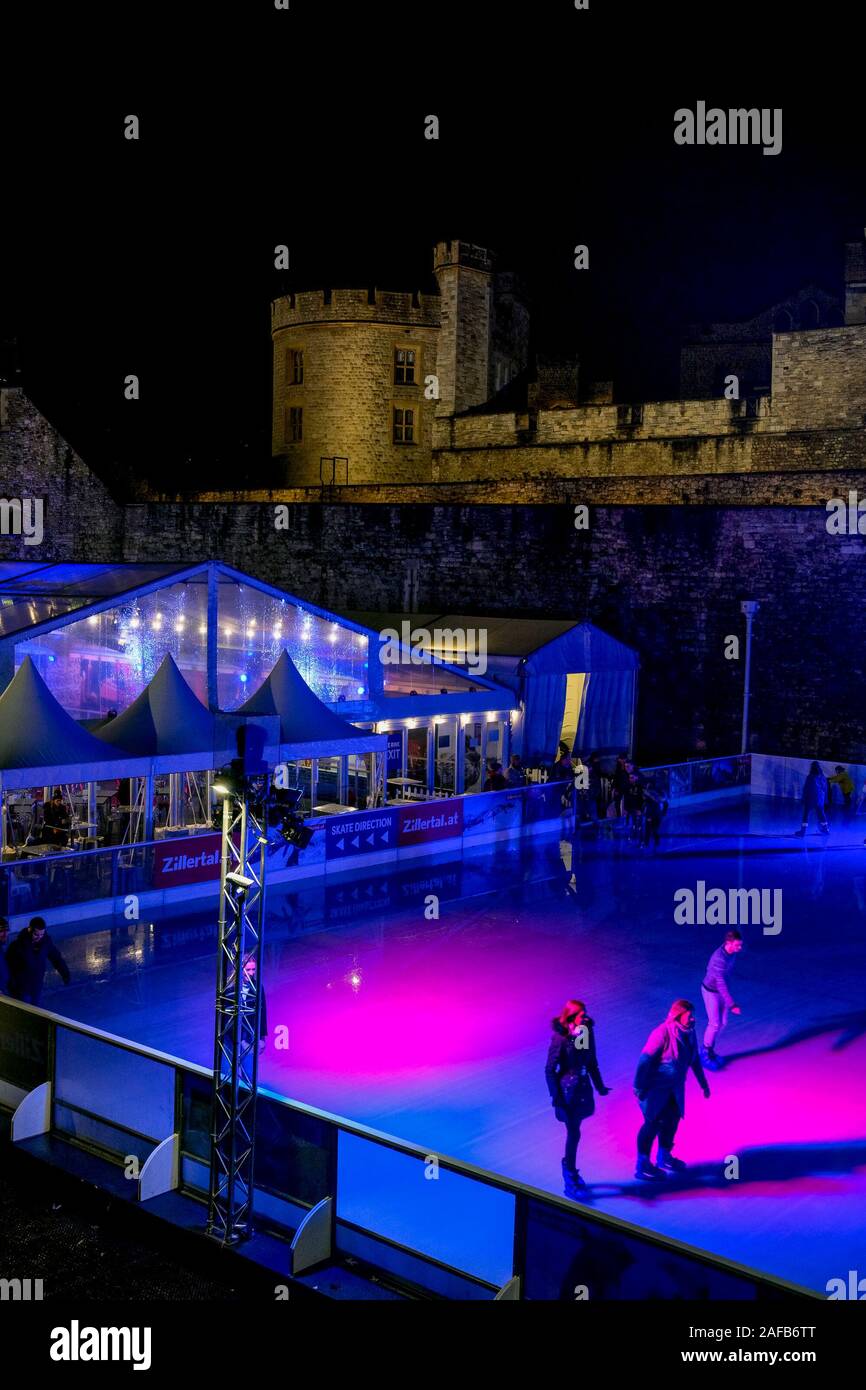 Ice skating rink, Tower of London, castle at night, London, England, UK ...