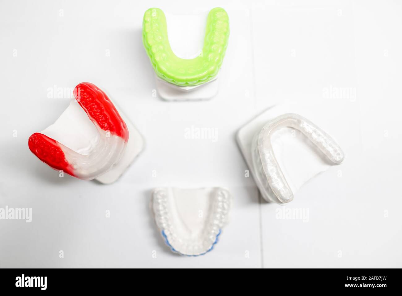 Gypsum models of artificial jaw with dental caps on the white ...