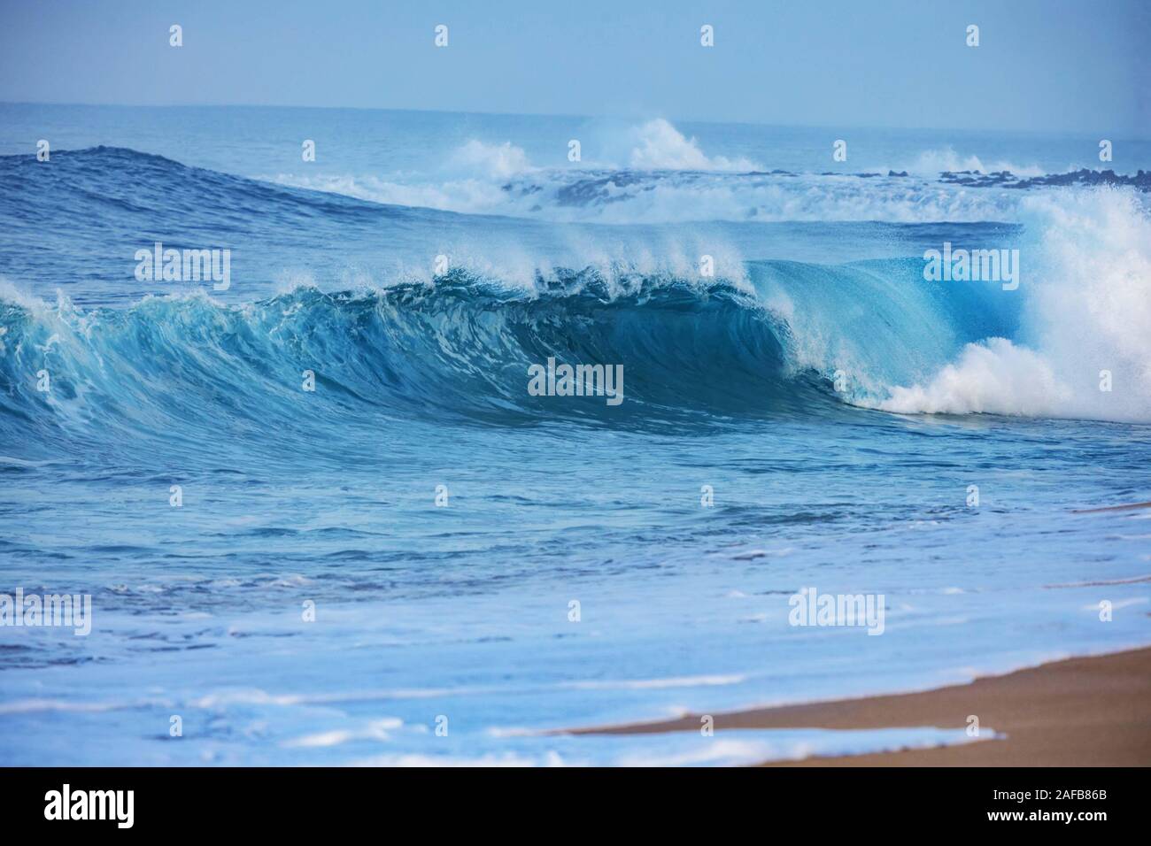 ocean wave falling down under sunset in lombok Stock Photo - Alamy