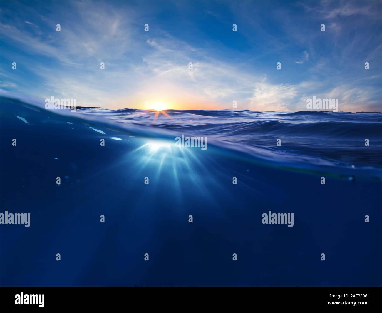 ocean wave falling down under sunset in lombok Stock Photo - Alamy