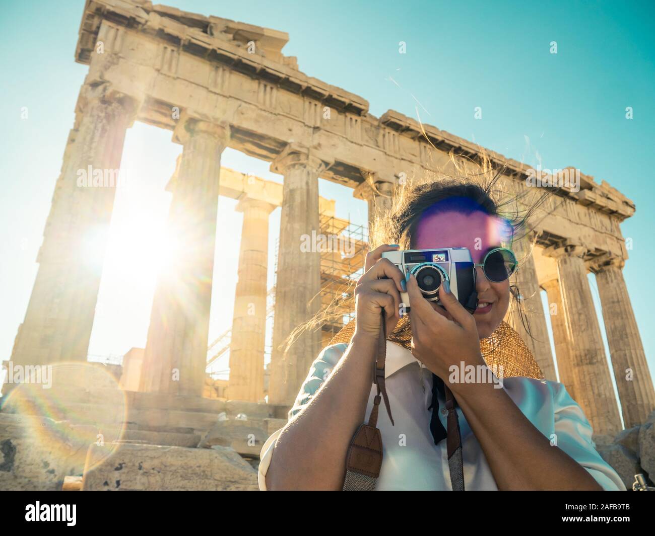 Young woman tourist taking pictures at parthenon in Athens acropolis, Greece Stock Photo - Alamy