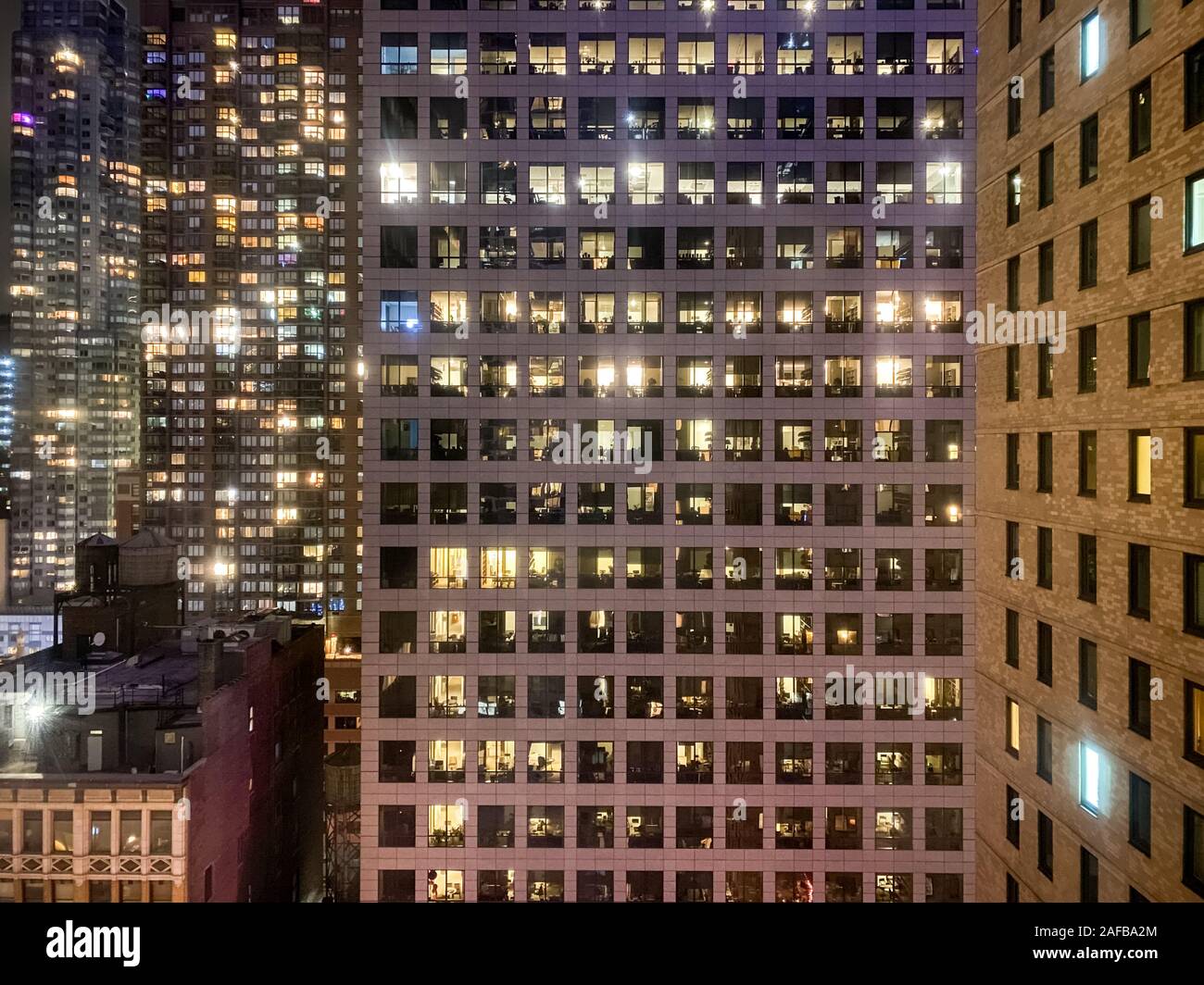 New York cityscape at night up close of towering building Stock Photo ...