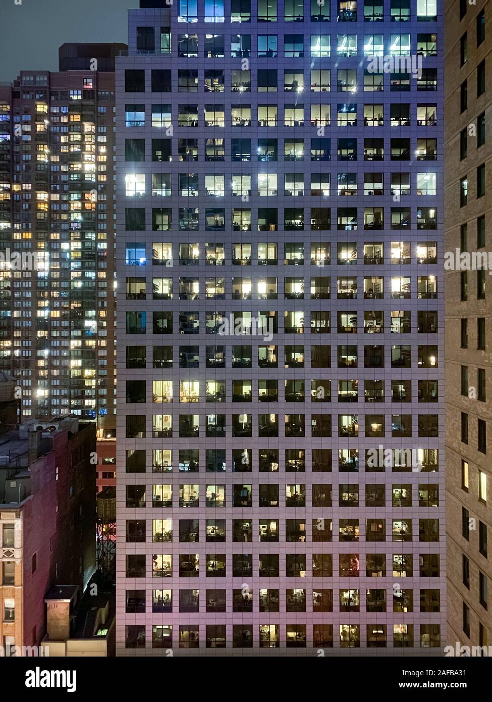 New York cityscape at night up close of towering building Stock Photo ...