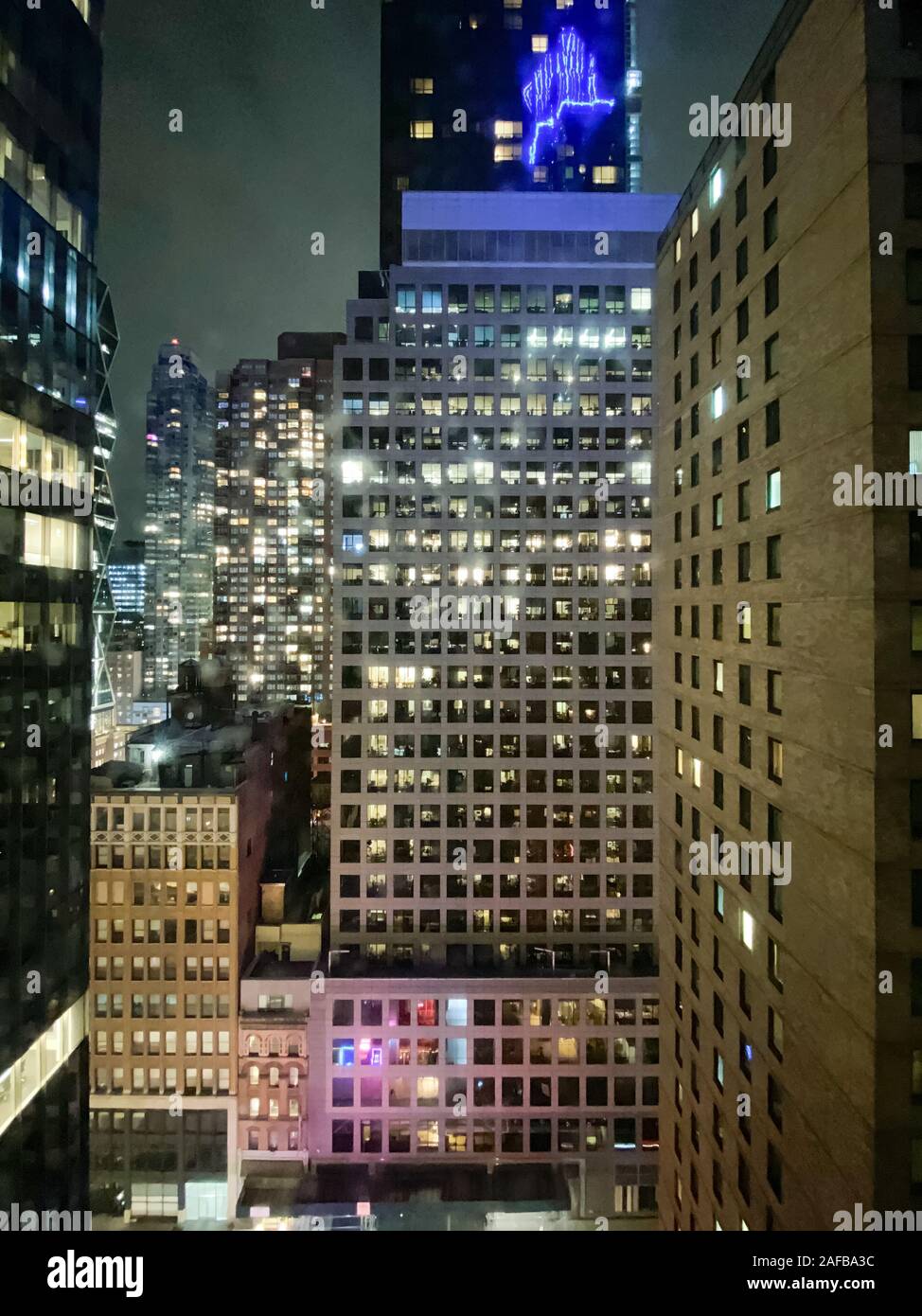 New York cityscape at night up close of towering building Stock Photo ...