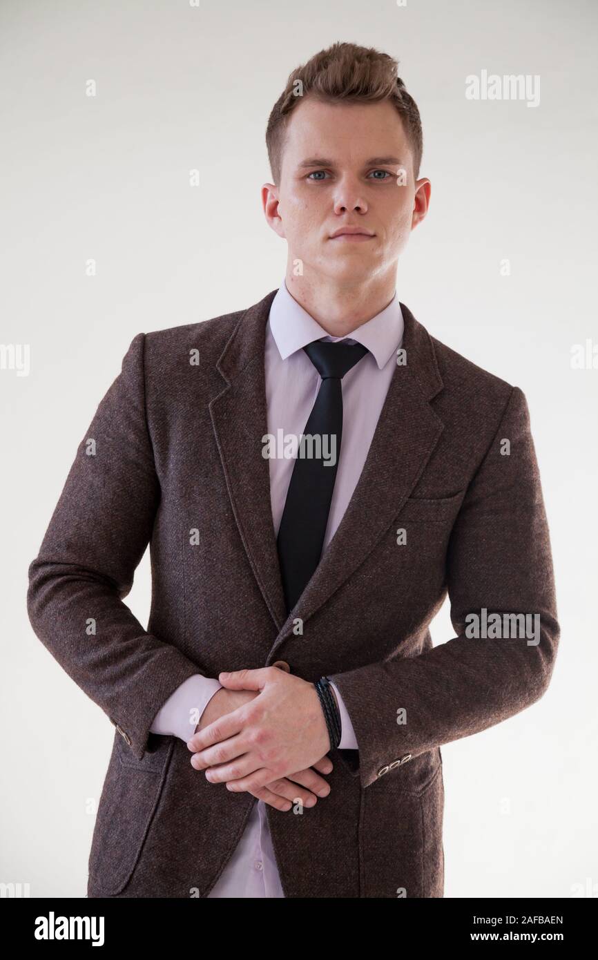 portrait of fashionable handsome business men at work in the office ...