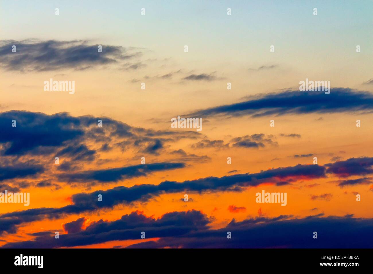 orange sunset sky with clouds. beautiful nature background Stock Photo ...