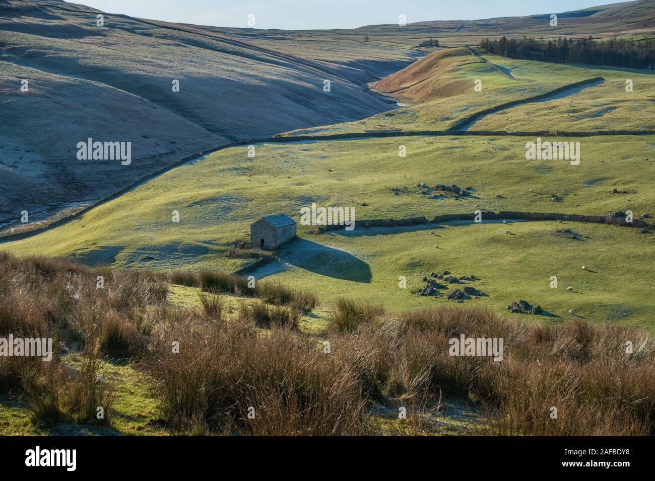 Malham Moor and an old stone barn on a cold and frosty winter's day ...