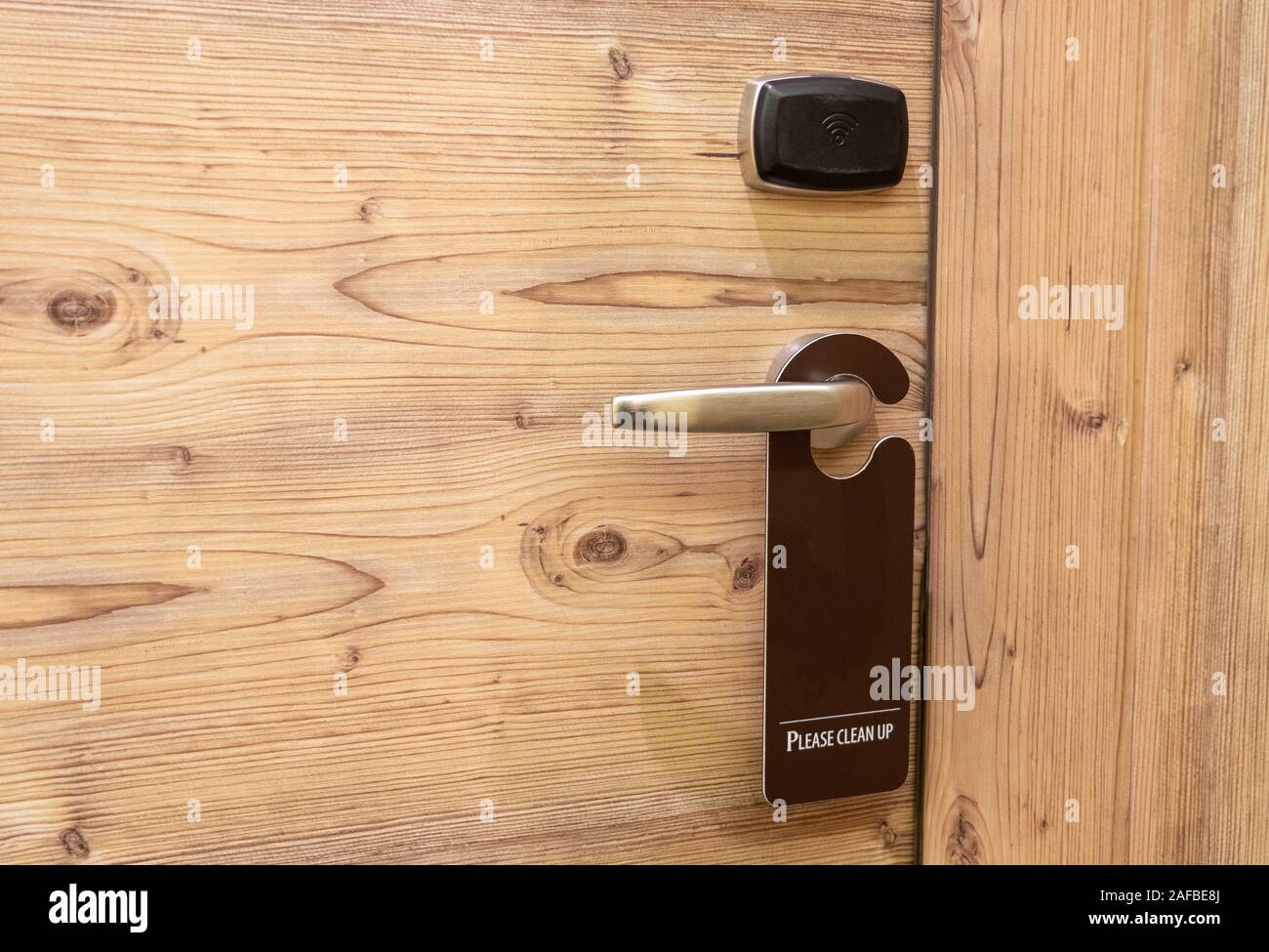 The hotel room with PLEASE MAKE UP ROOM sign on the door Stock Photo ...