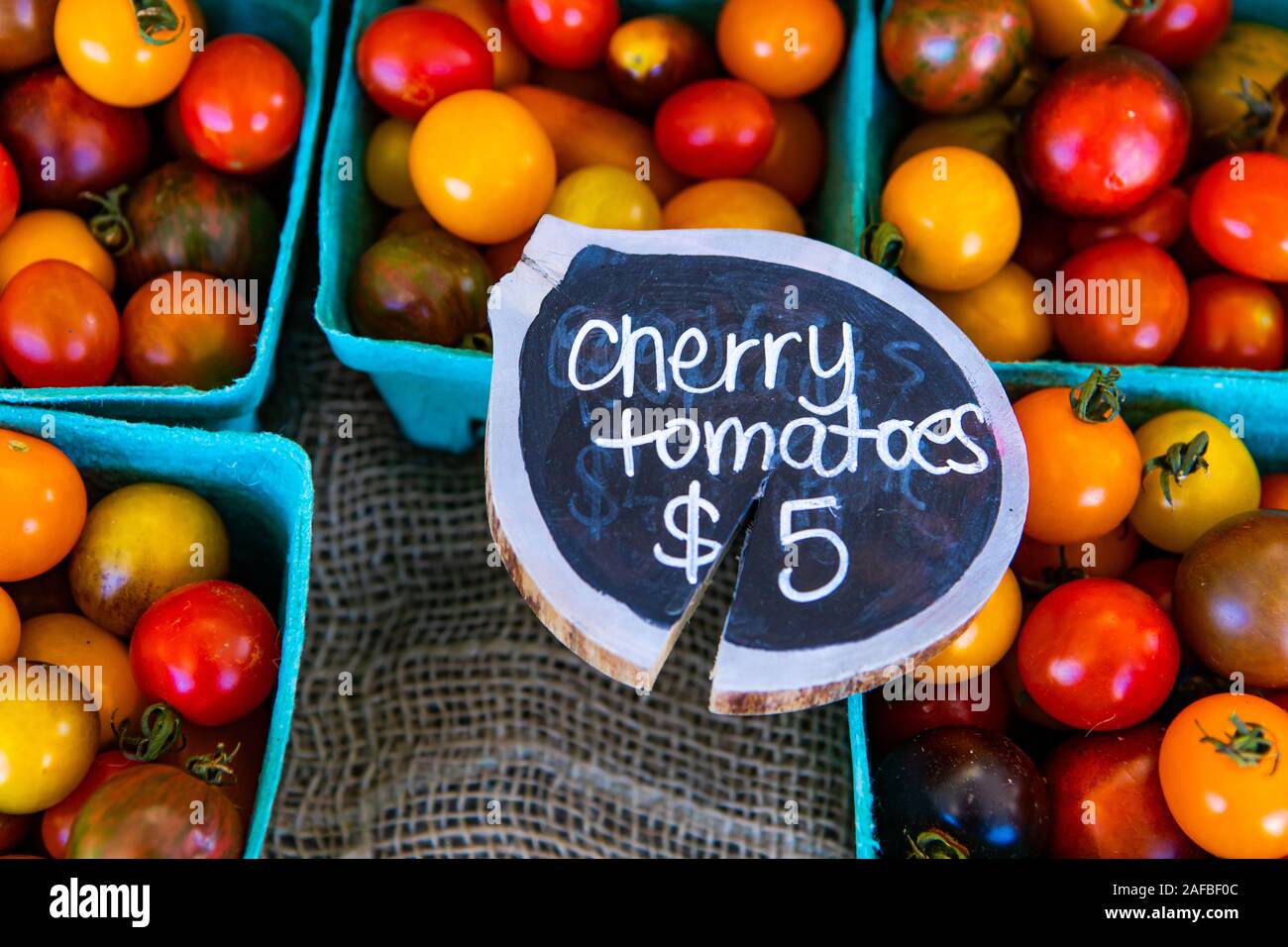 A close up and high angle view of a rustic wooden price sign ...